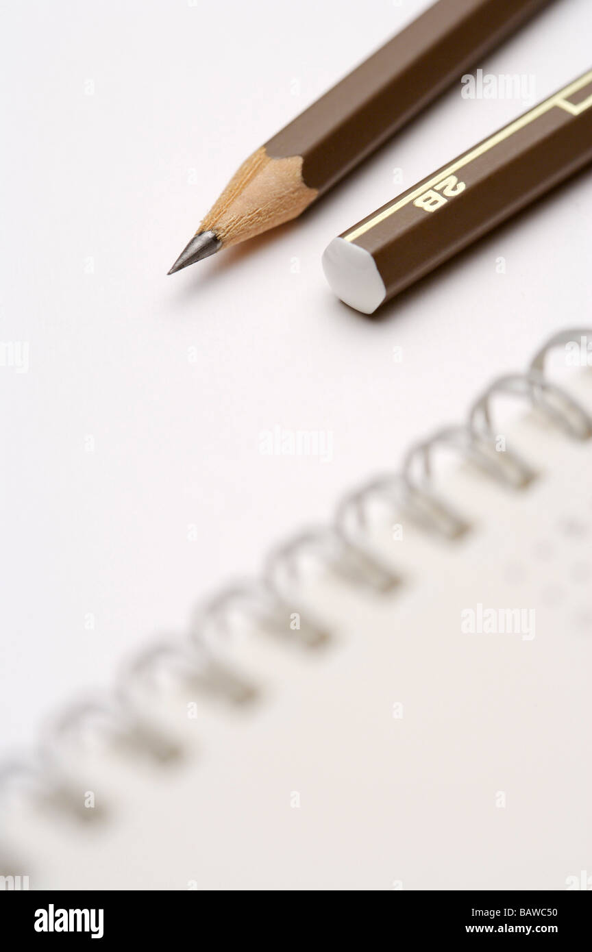 Spiral notebook and pencils Stock Photo - Alamy