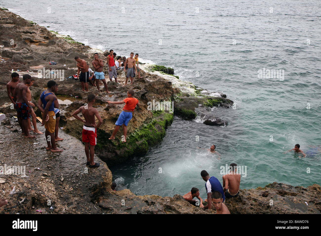 Malecón, boys jump in the water of the rocks in Havana Cuba Stock Photo ...