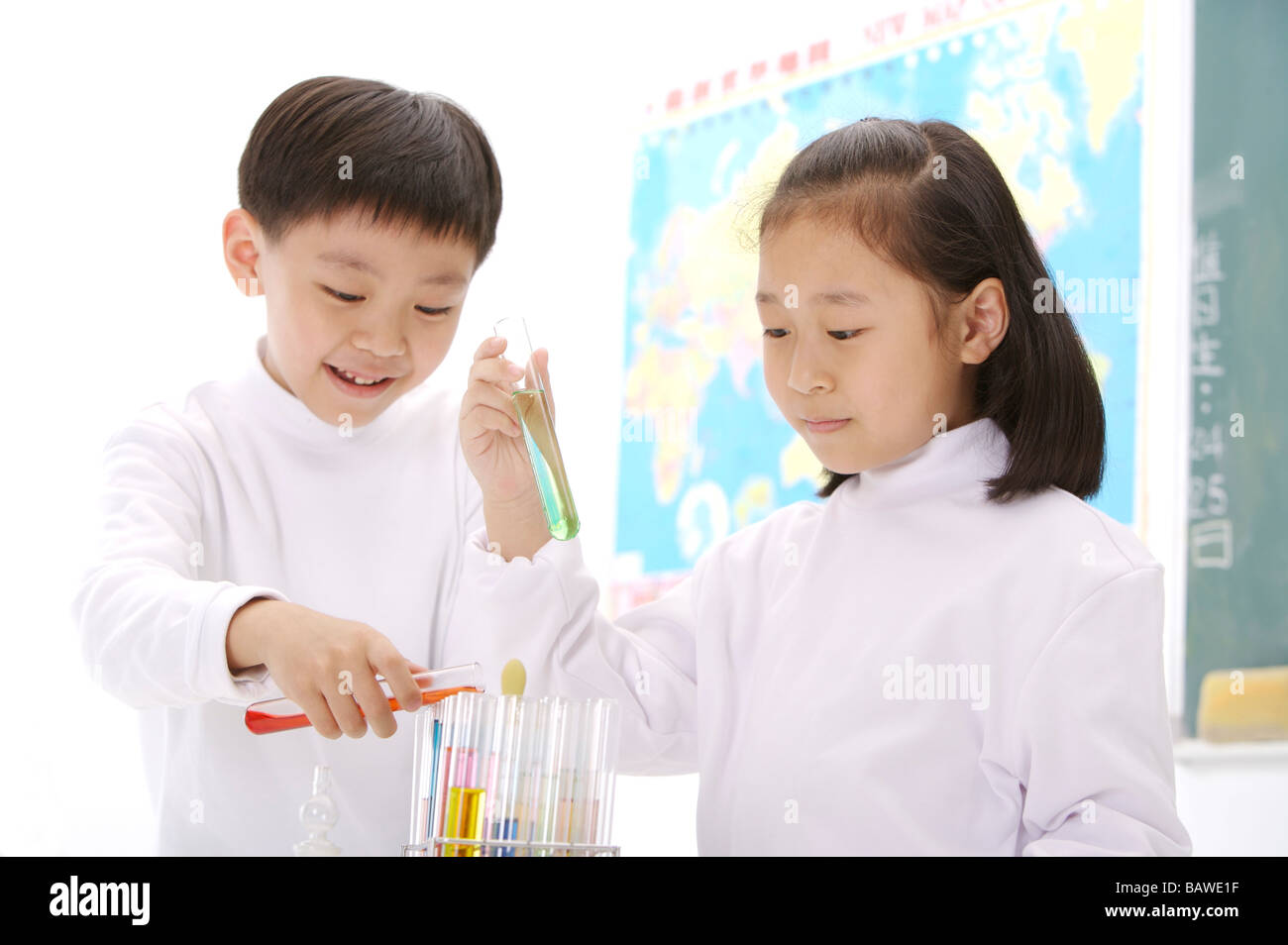 Children doing experiments in classroom Stock Photo - Alamy