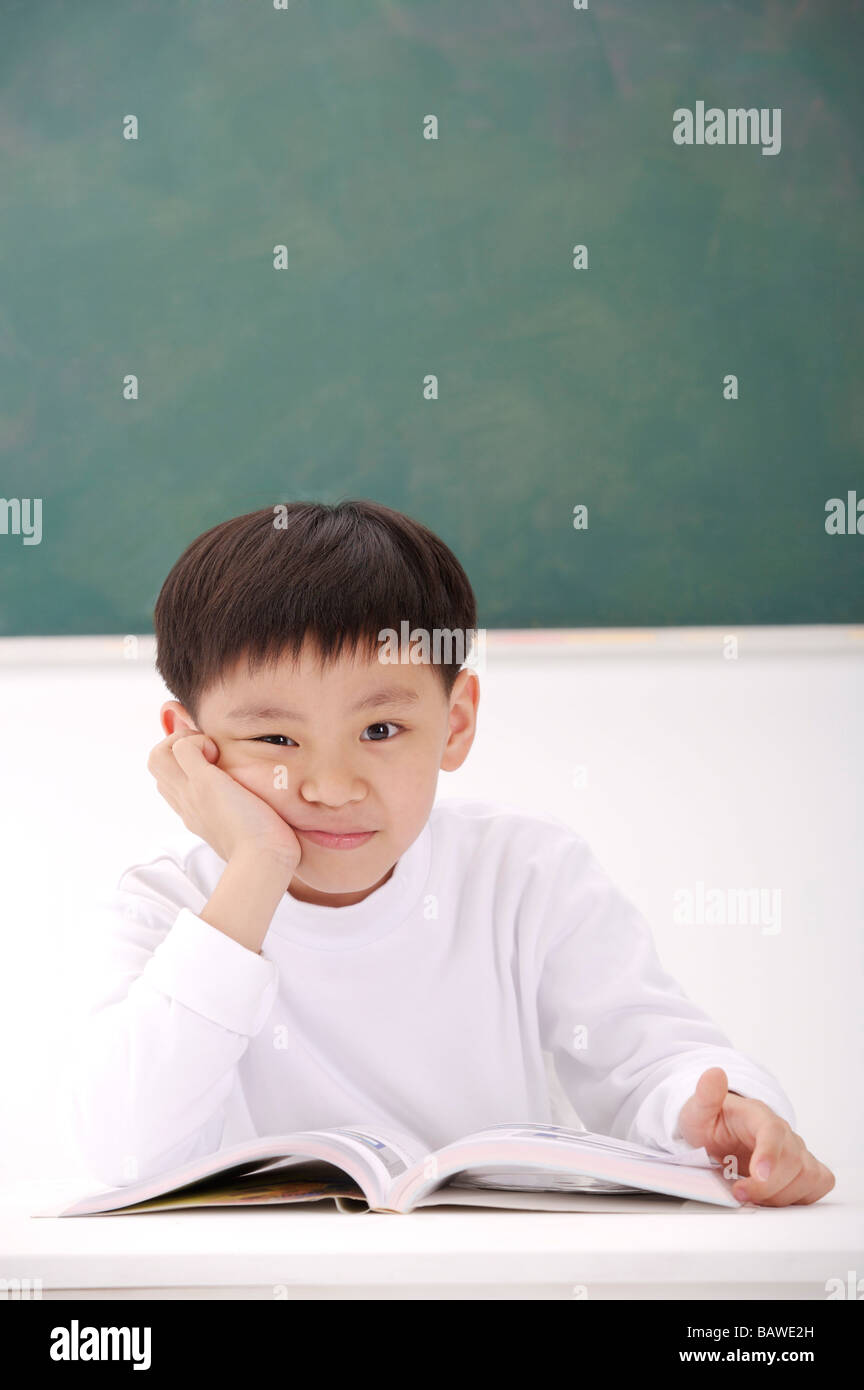 Book open in front of face hi-res stock photography and images - Alamy