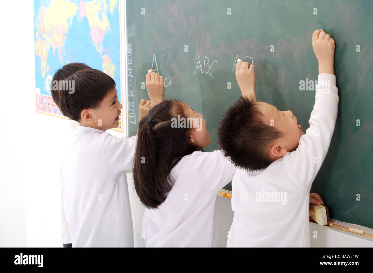 Children Writing On Blackboard High Resolution Stock Photography and ...