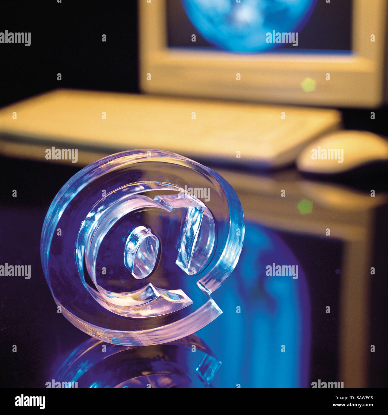 At symbol on computer desk Stock Photo - Alamy