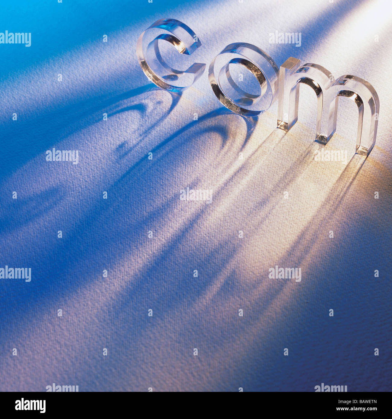 Lights shining on the word com Stock Photo - Alamy