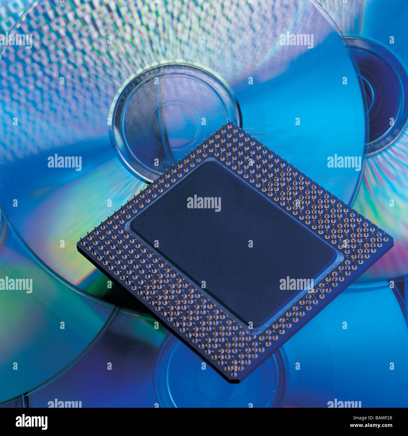 Computer chip on top of compact disc Stock Photo - Alamy