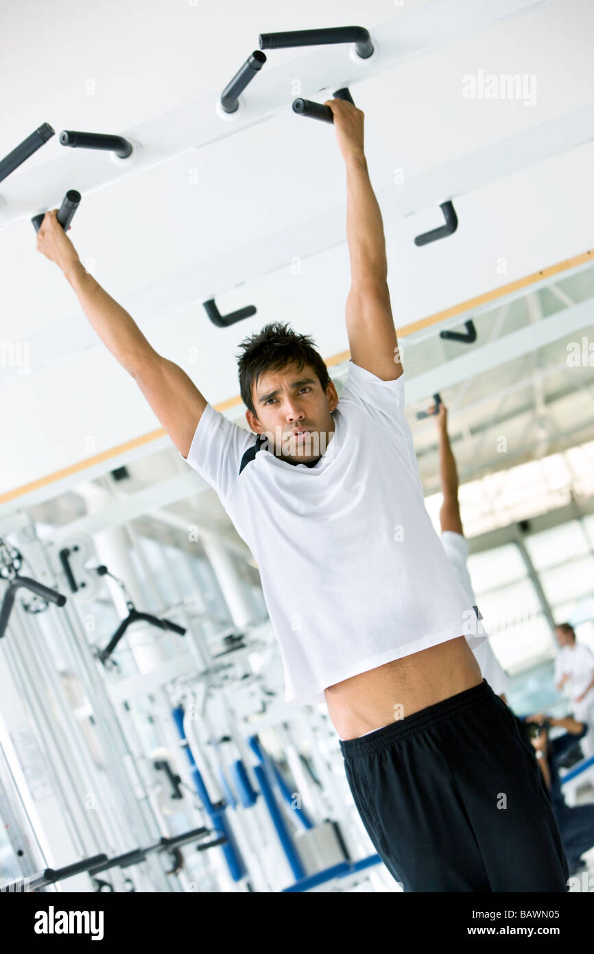 Man doing chin ups Stock Photo - Alamy