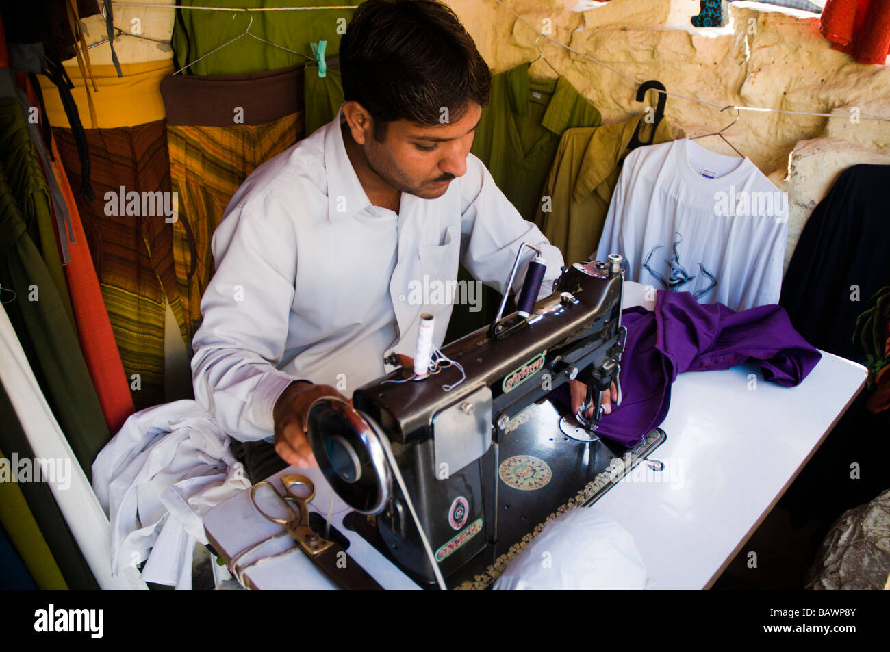 indian tailor uses his sewing machine Stock Photo - Alamy