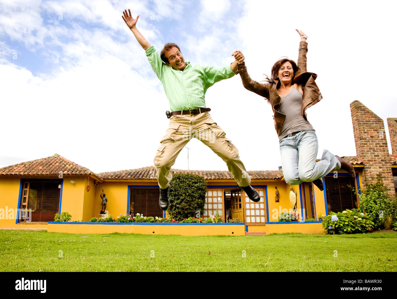 happy couple jumping Stock Photo - Alamy