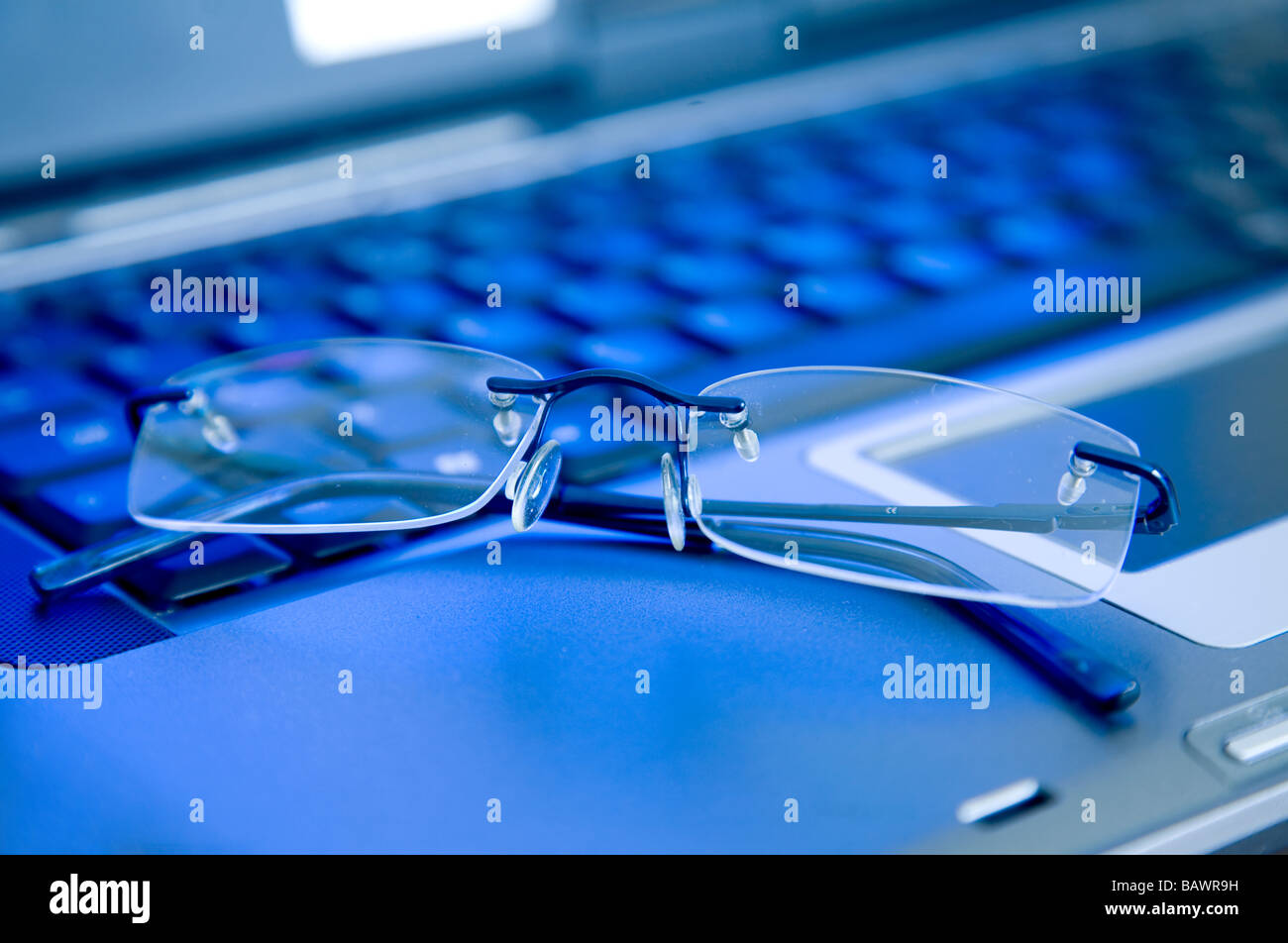 business glasses on a laptop keyboard Stock Photo - Alamy