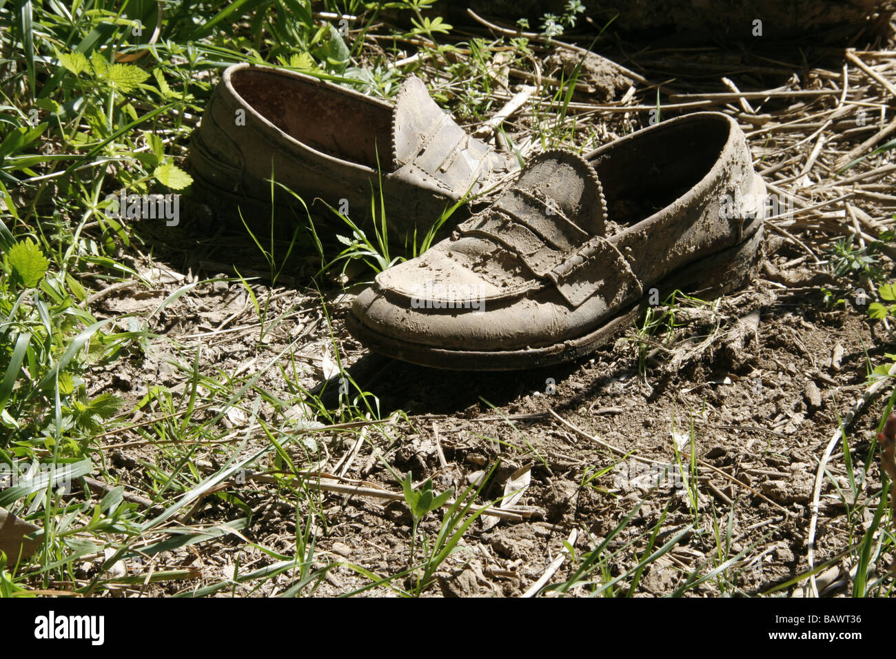 Mud covered shoes hi-res stock photography and images - Alamy