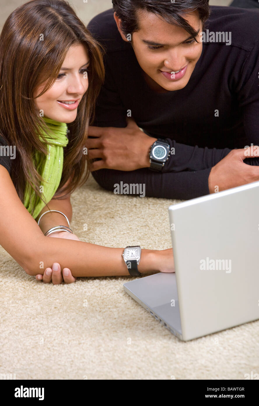 Couple on a laptop at home Stock Photo - Alamy