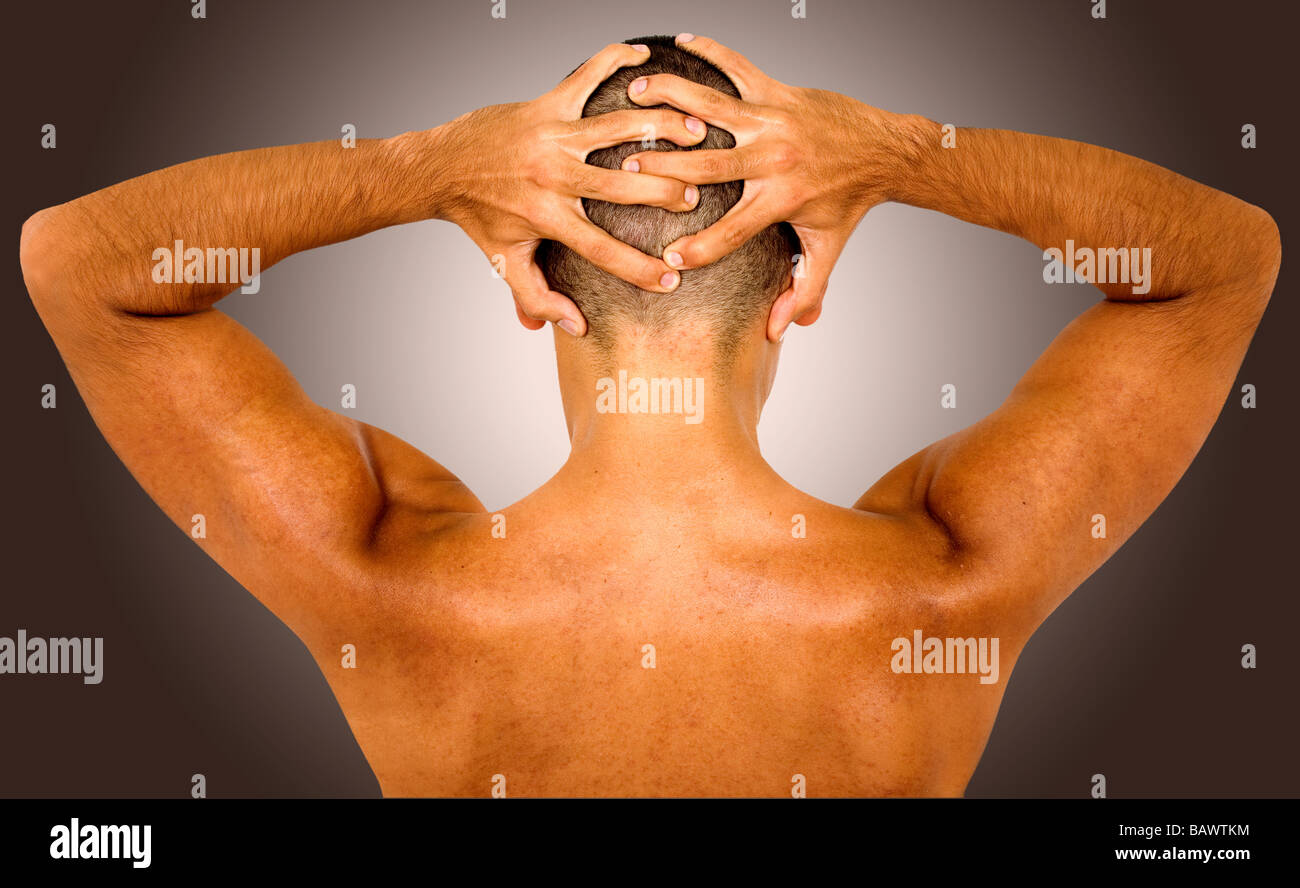 muscular man showing his back muscles Stock Photo - Alamy