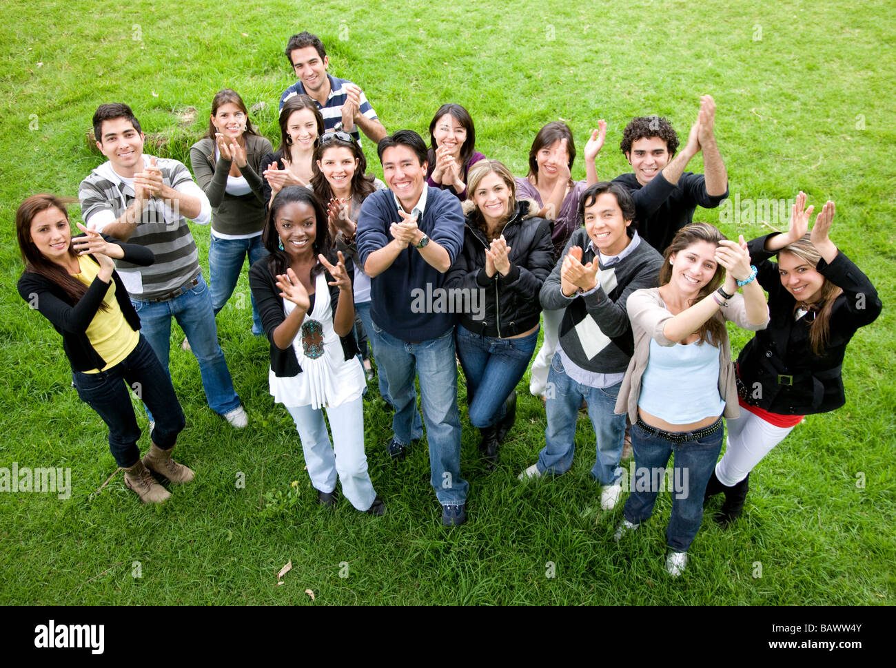 casual friends clapping in the park Stock Photo - Alamy