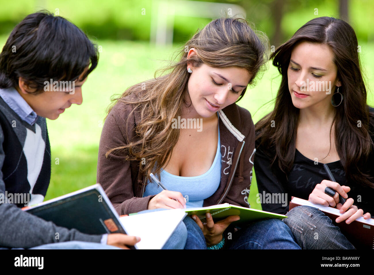 friends or students smiling Stock Photo - Alamy