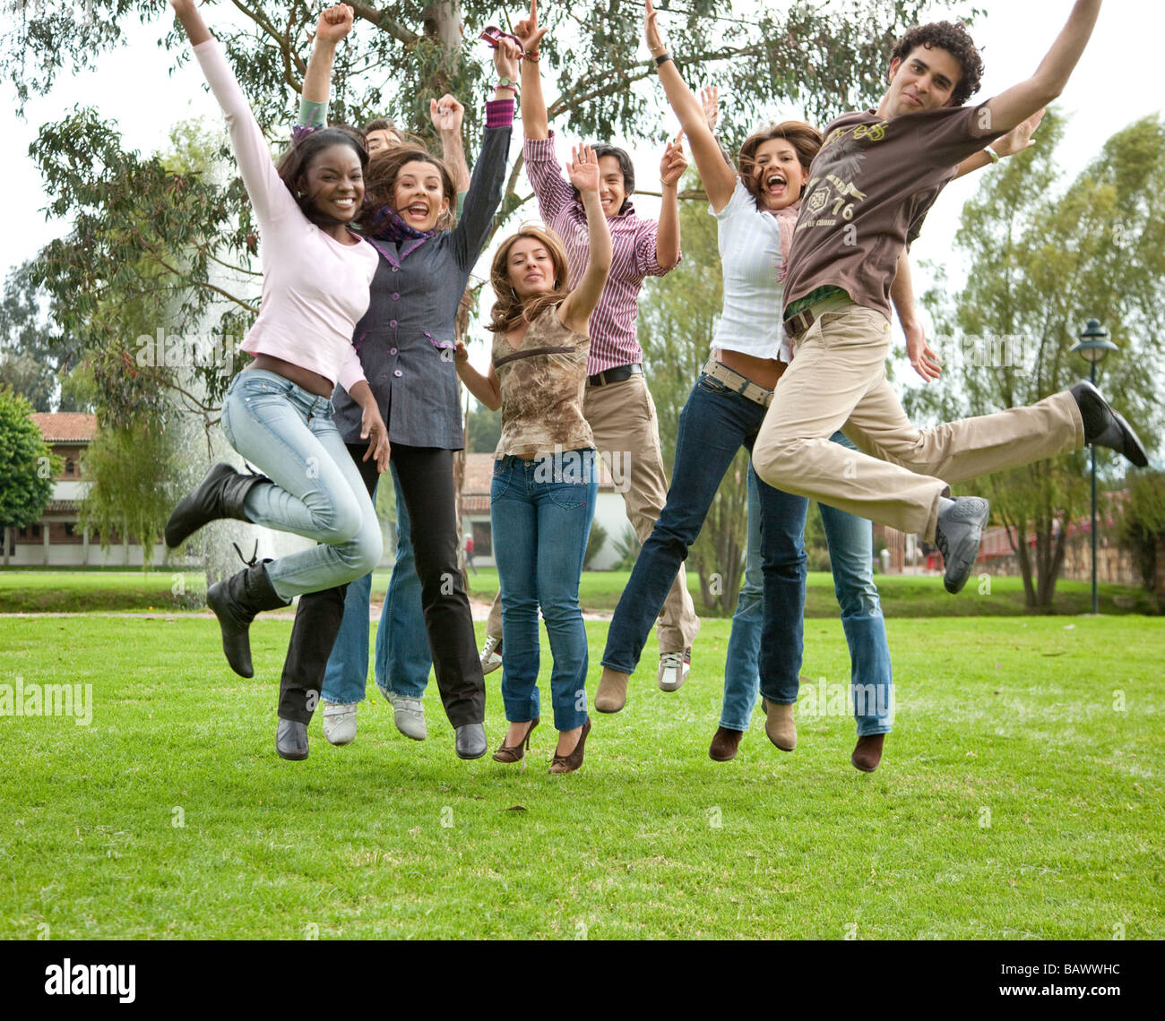 Group of friends jumping Stock Photo - Alamy