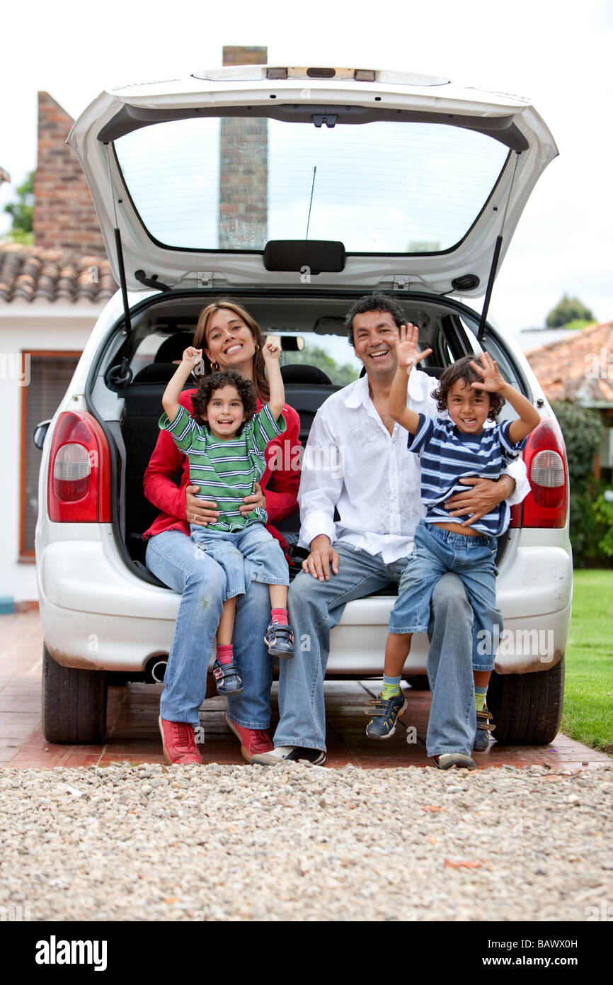 Family with a car Stock Photo - Alamy