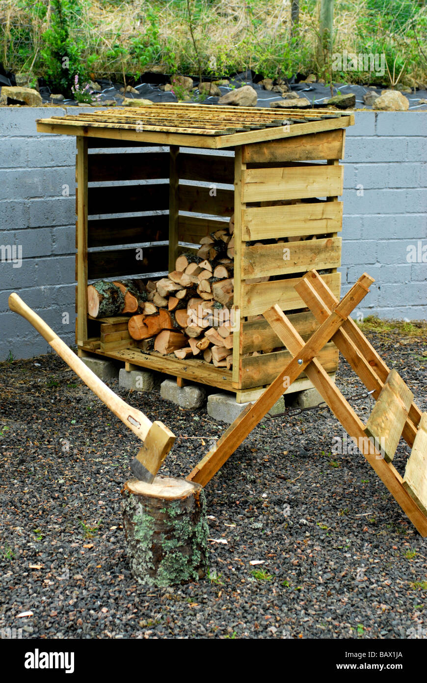Log store chopping block and axe ready and waiting for some fresh wood ...