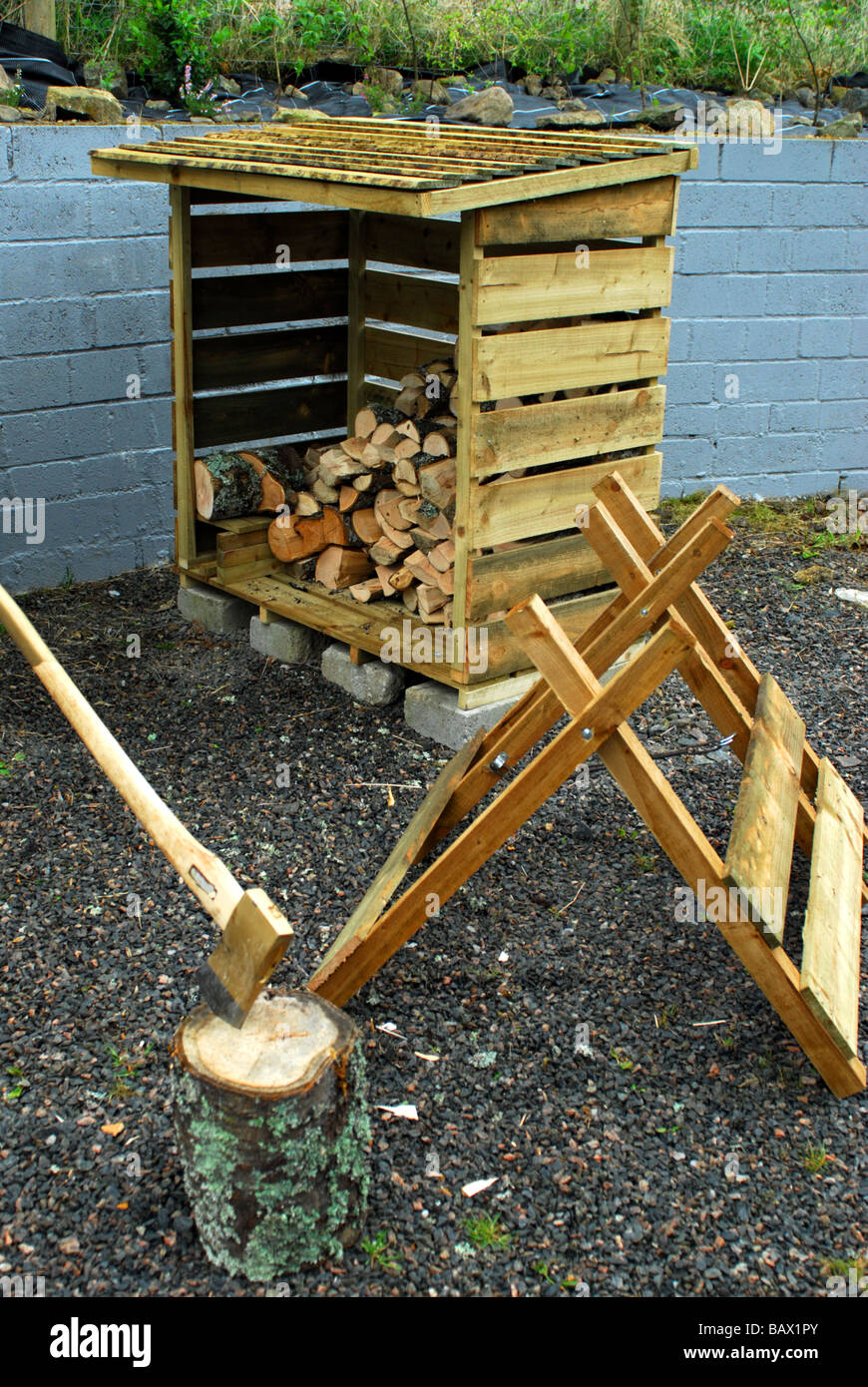 Log store chopping block and axe ready and waiting for some fresh wood ...