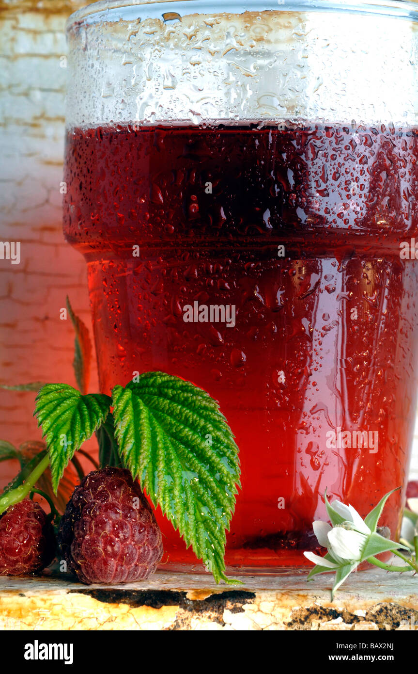 Glass of raspberry tea Stock Photo - Alamy