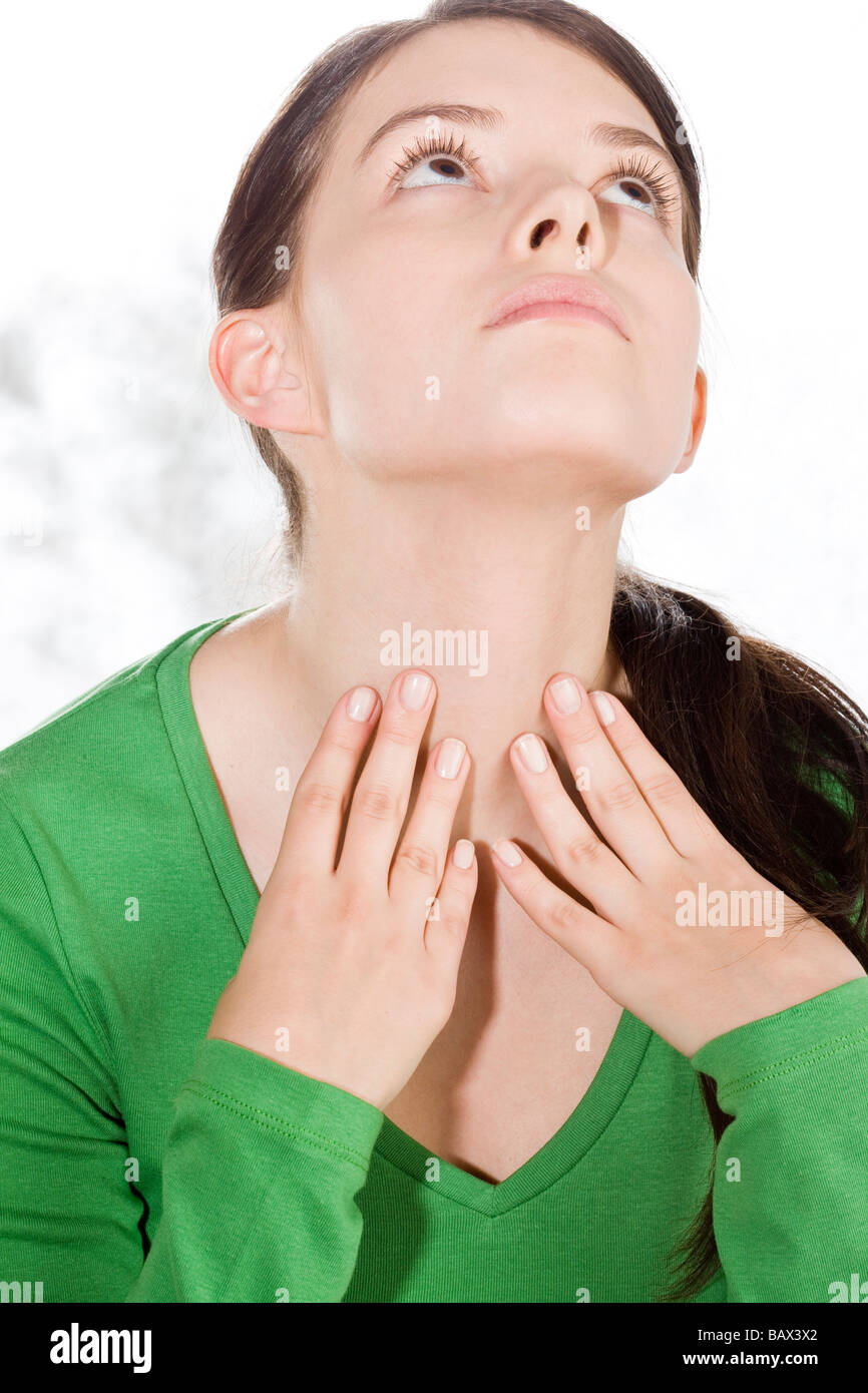 woman touching her neck Stock Photo - Alamy
