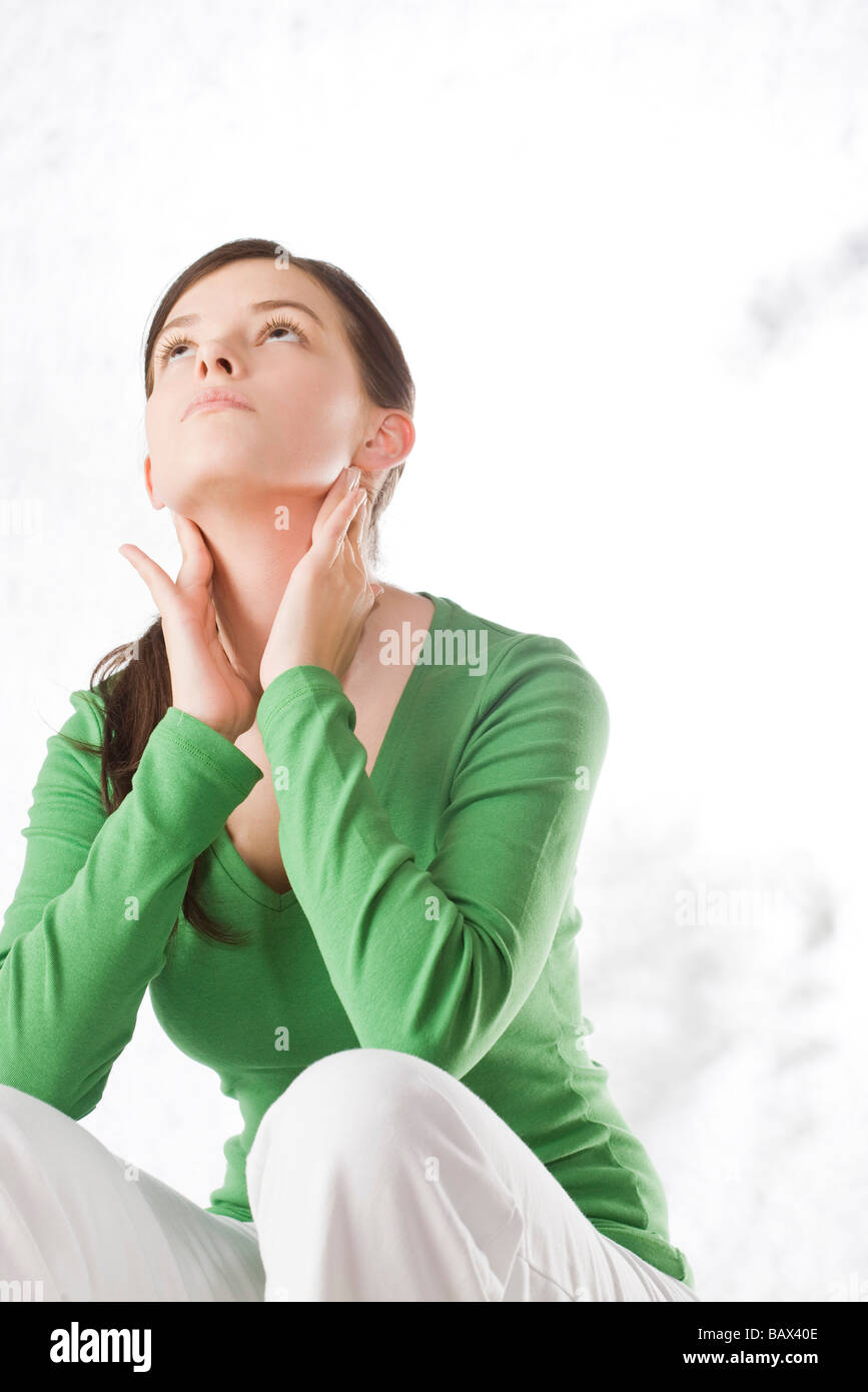 woman touching her neck Stock Photo - Alamy
