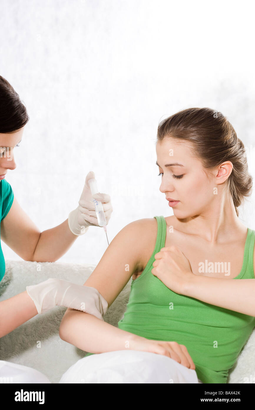 Woman injection arm hi-res stock photography and images - Alamy