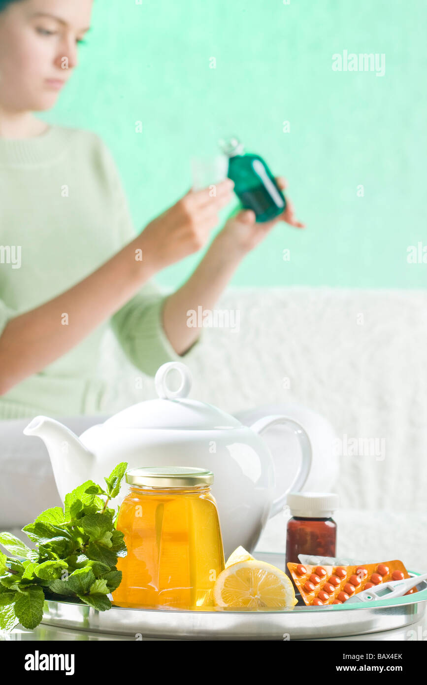 woman taking syrup Stock Photo - Alamy