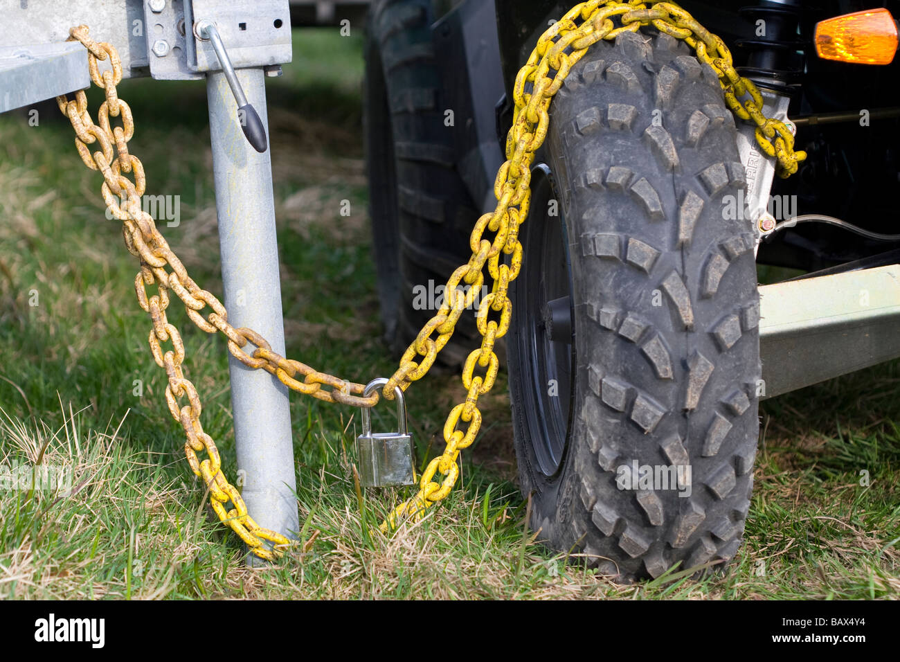 Chain and lock on atv Stock Photo - Alamy