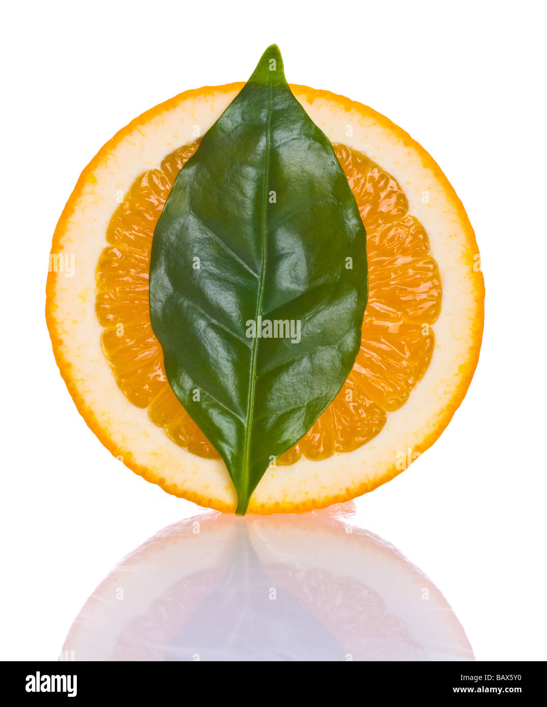 Slice of orange and leaf isolated on white Stock Photo - Alamy