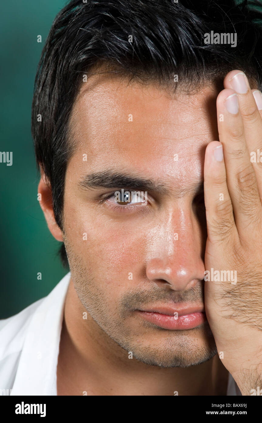 Mans face covered hand hi-res stock photography and images - Alamy