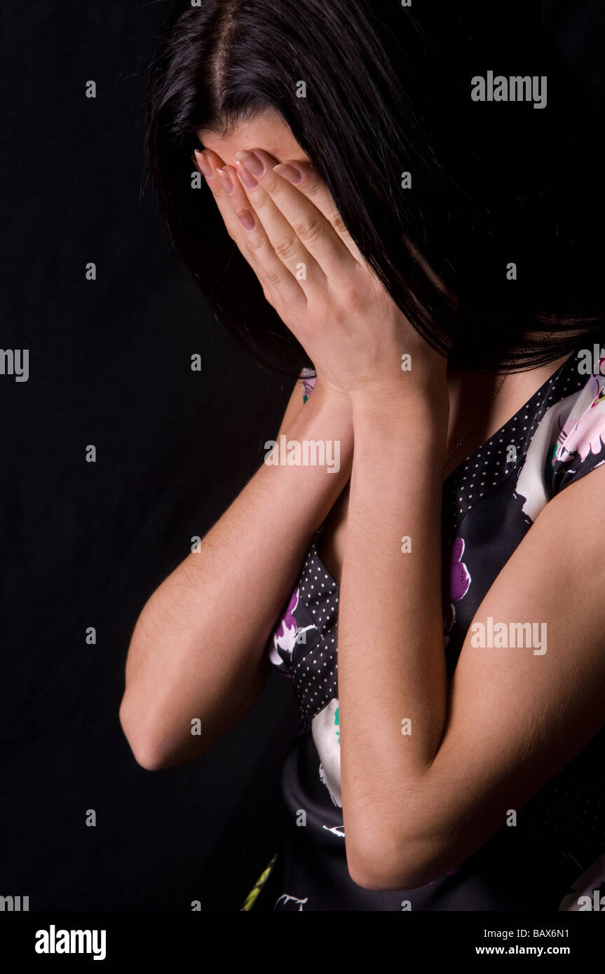 Woman head in hands crying Stock Photo - Alamy