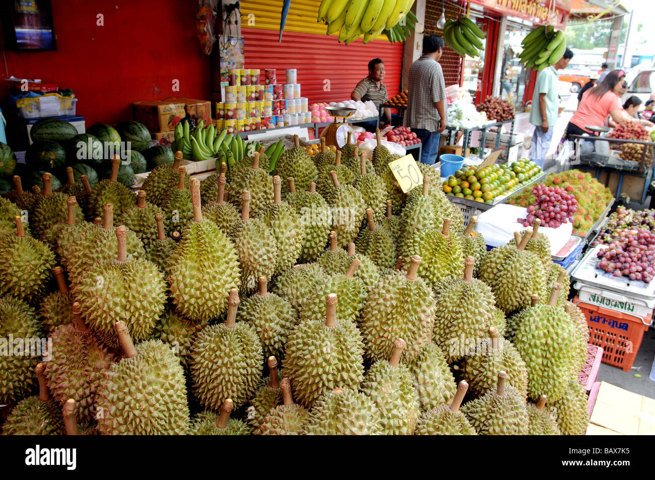 durian in market stall kanchanaburi thailand Stock Photo - Alamy