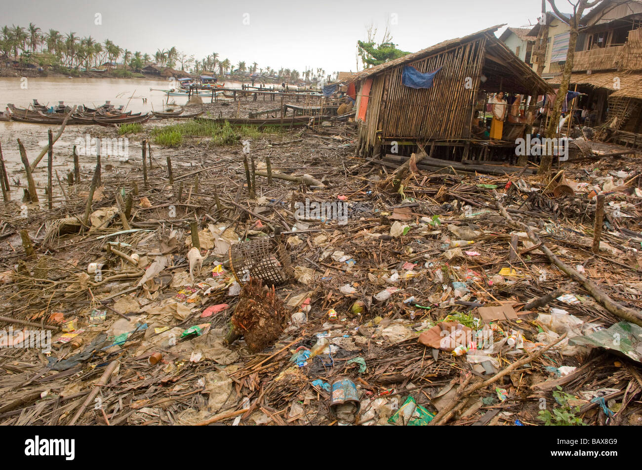 Piles of rubbish litter a village in the delta after Cyclone Nargis ...