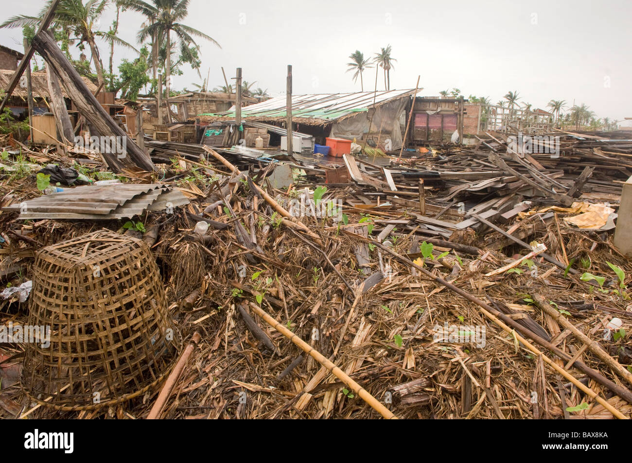 Destroyed remains of a village on the delta after Cyclone Nargis struck ...