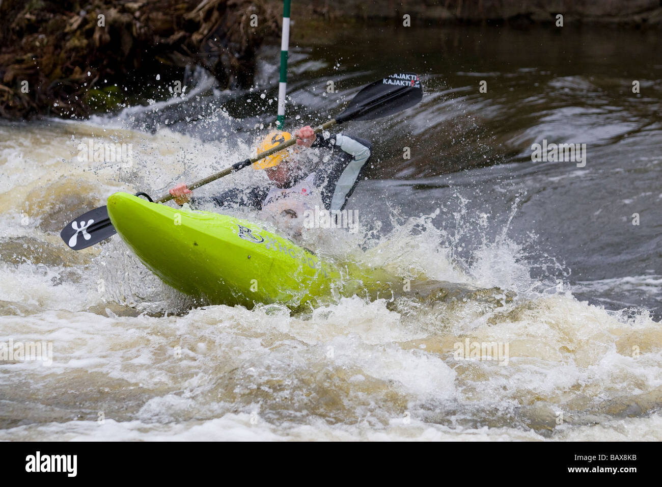 Person competing in a canoe slalom competition Stock Photo - Alamy