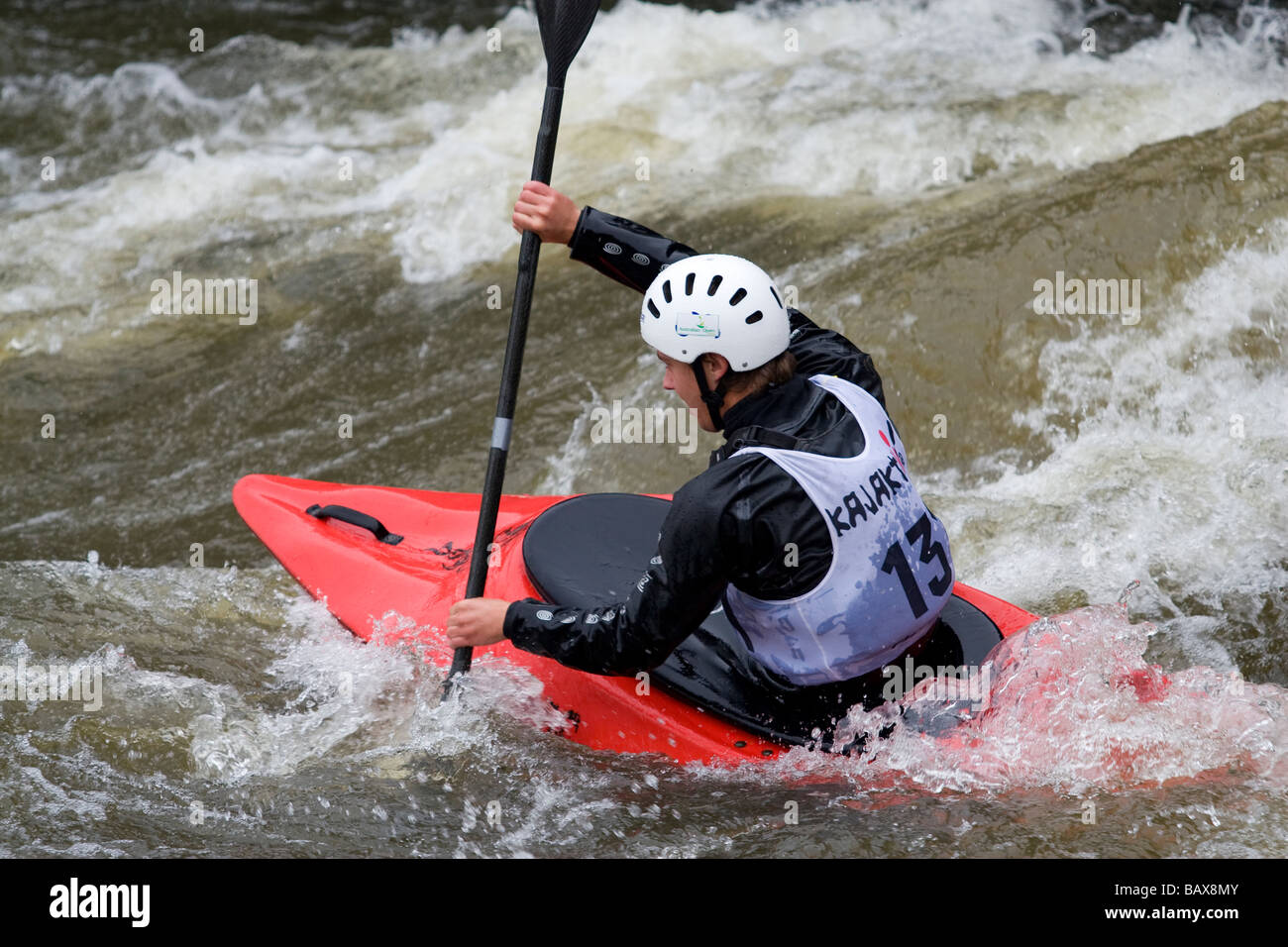 Person competing in a canoe slalom competition Stock Photo - Alamy
