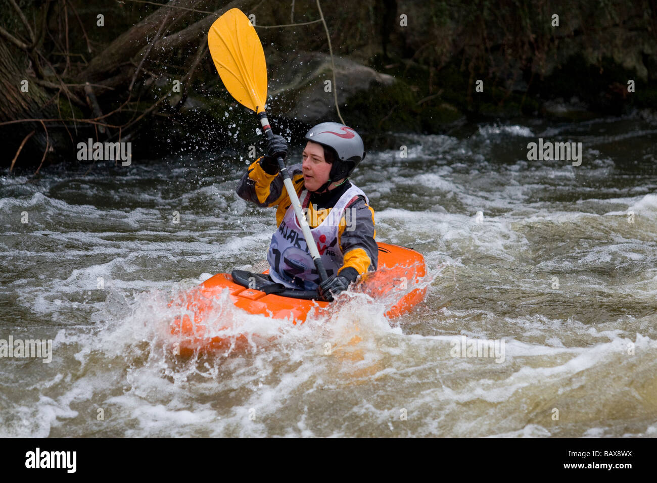 Person competing in a canoe slalom competition Stock Photo - Alamy