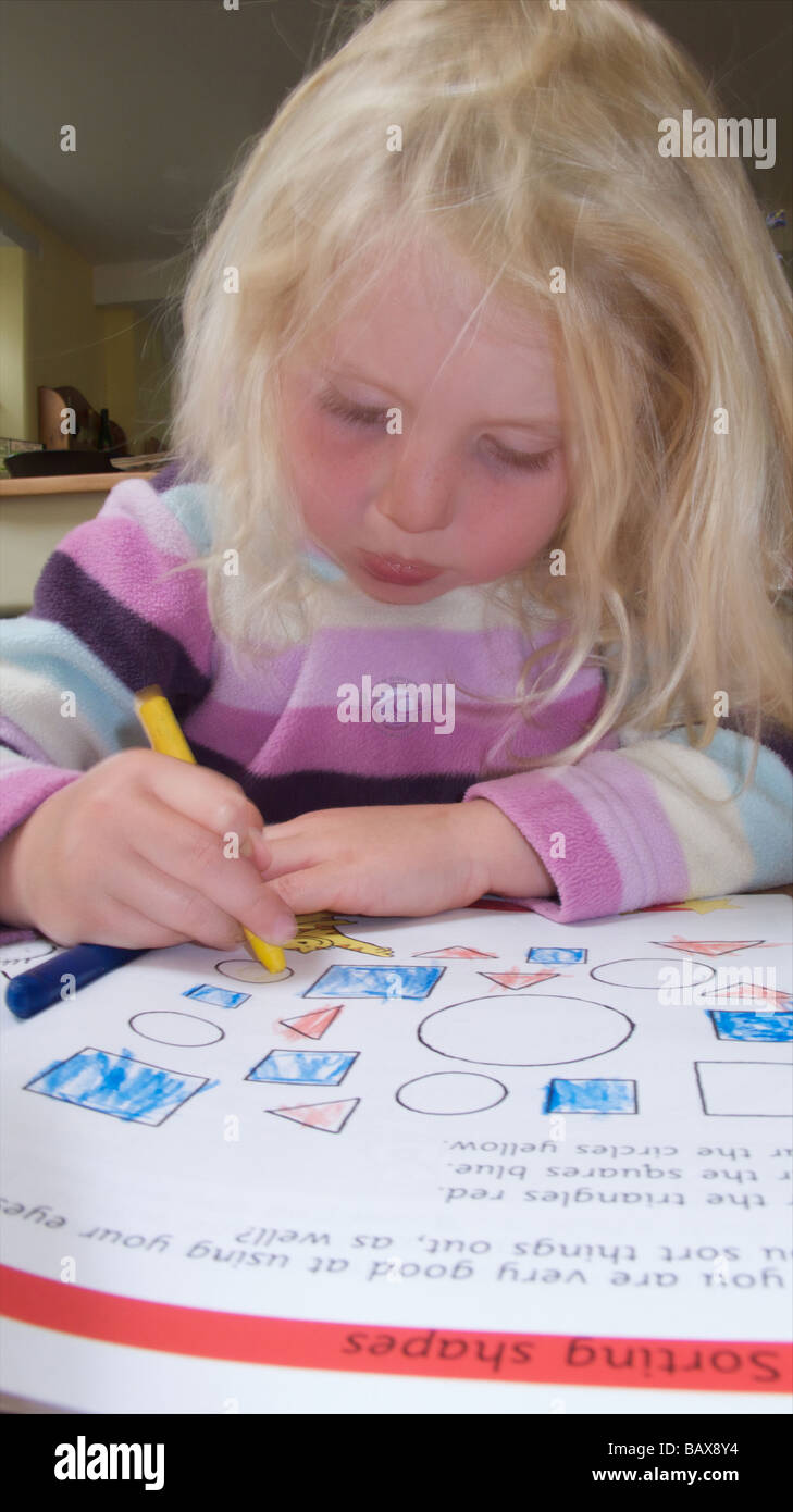 Children drawing and colouring and doing homework at home Stock Photo ...