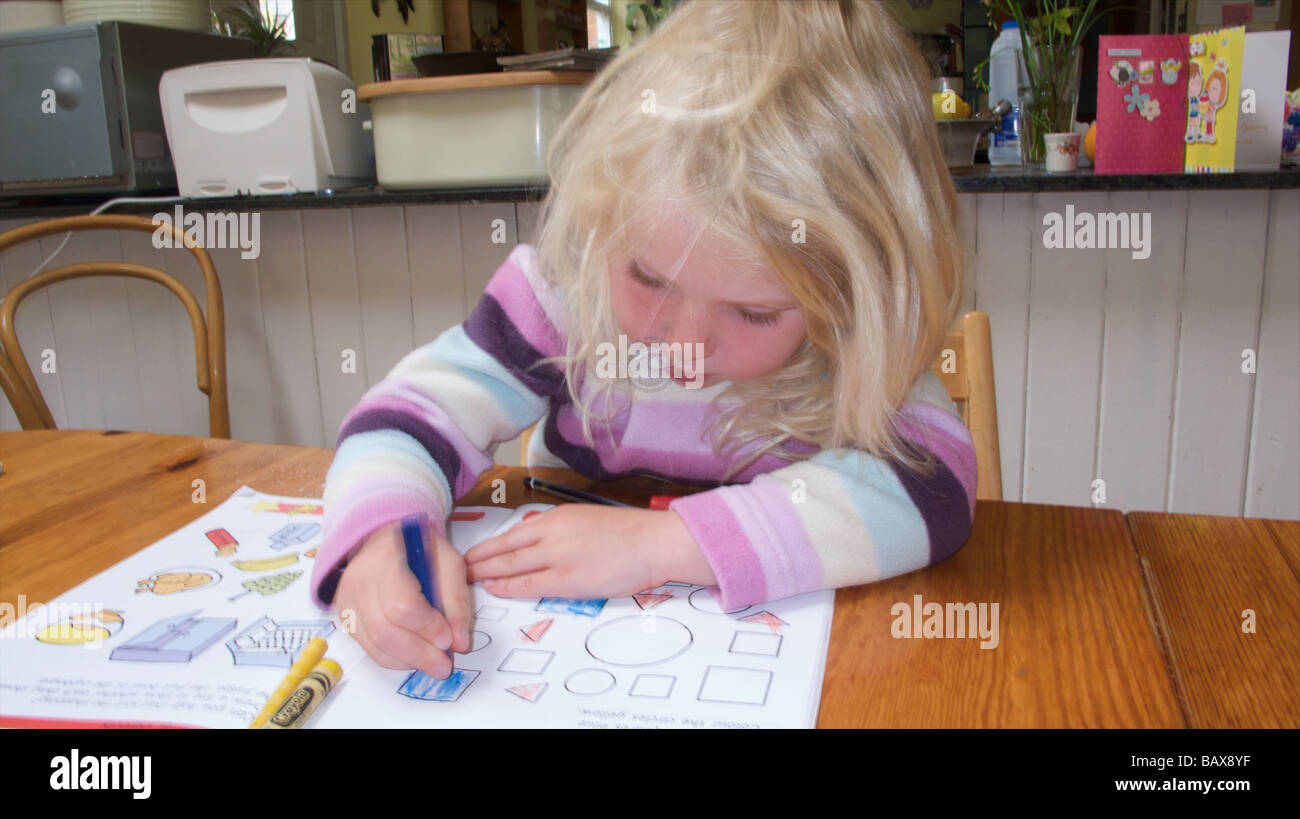 Children drawing and colouring and doing homework at home Stock Photo ...