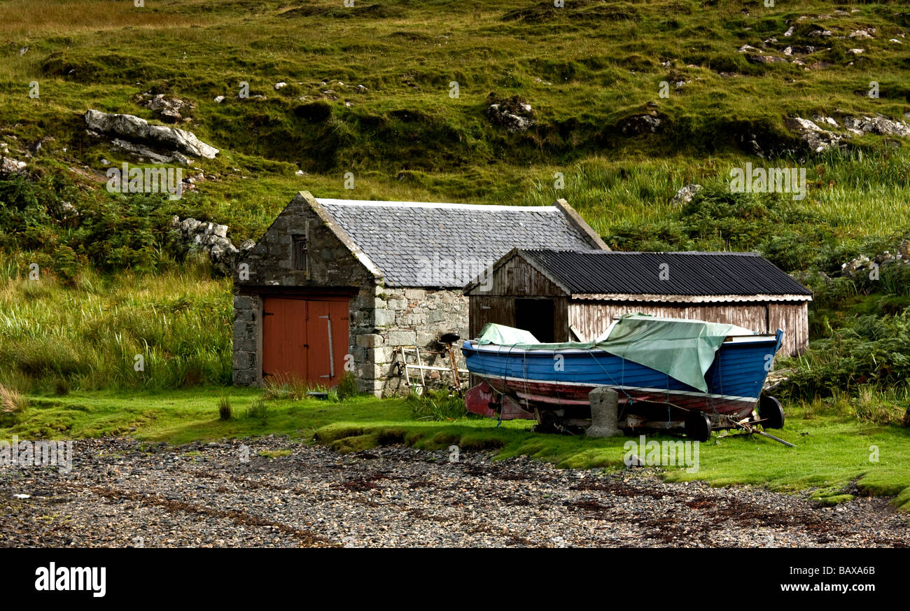 Scotland; Boat docked by boathouse Stock Photo - Alamy