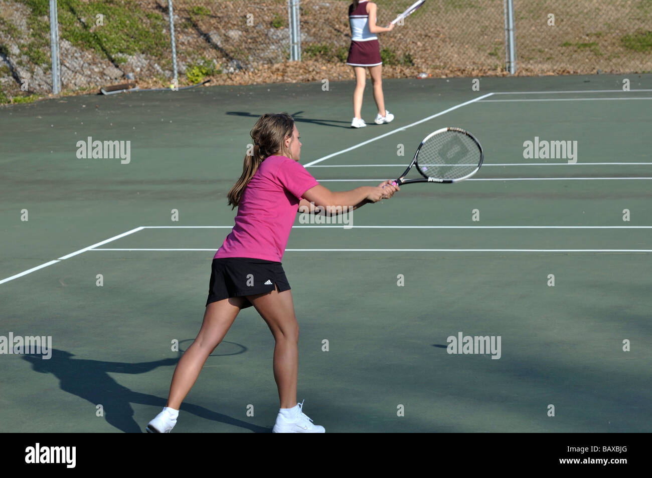 American high school girl playing tennis Stock Photo - Alamy