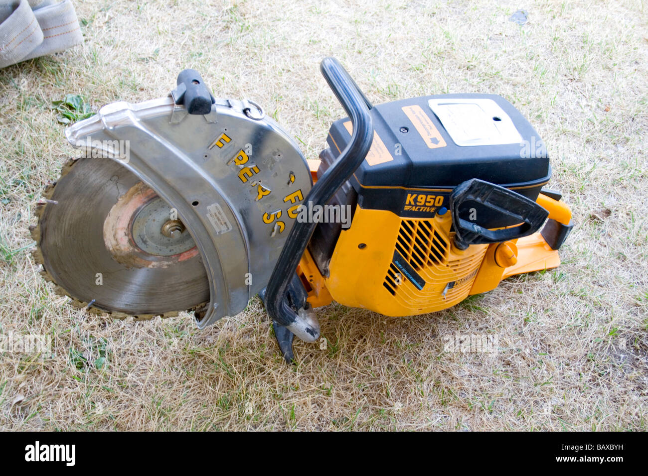 Rugged firefighters circular hand saw at rescue demonstration ...