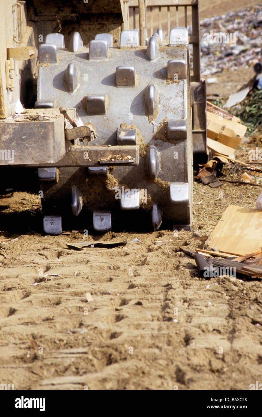 machine compact soil dirt build construct landfill waste dump trash ...