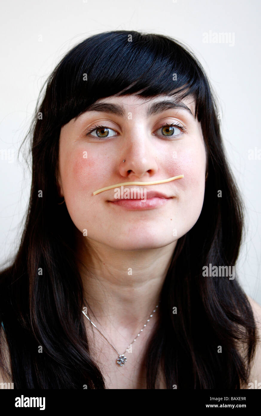 A portrait of a young woman with a spaghetti moustache Stock Photo - Alamy