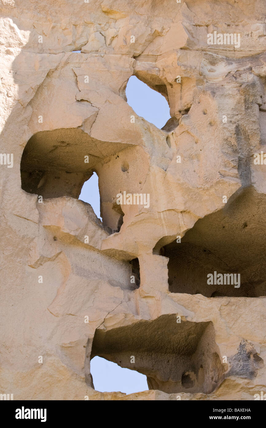 Holes in rock formations in Cappadocia Turkey Stock Photo - Alamy