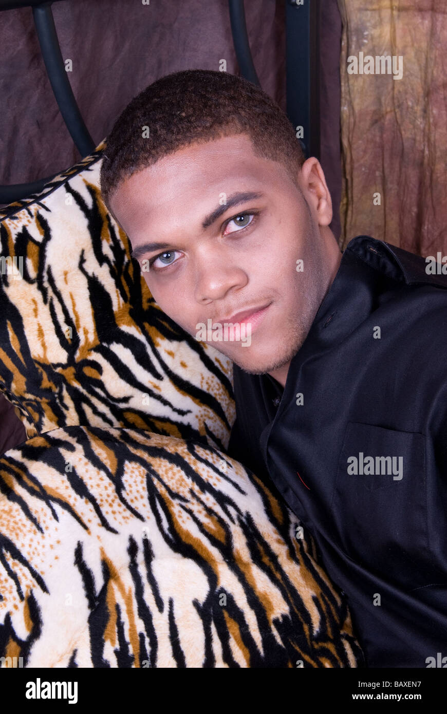 African American vampire grins as he wakes up for a night on the town ...