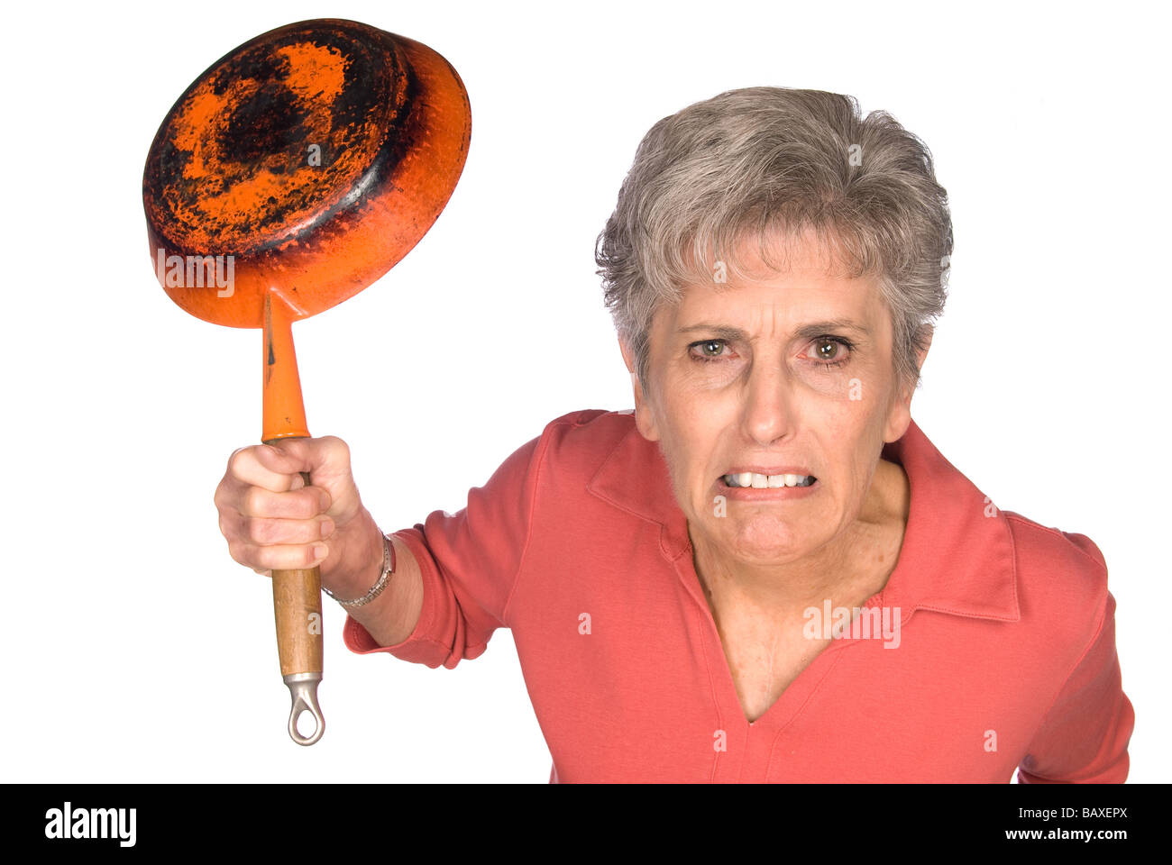 An angry woman getting ready to swing a frying pan Image was shot on a ...