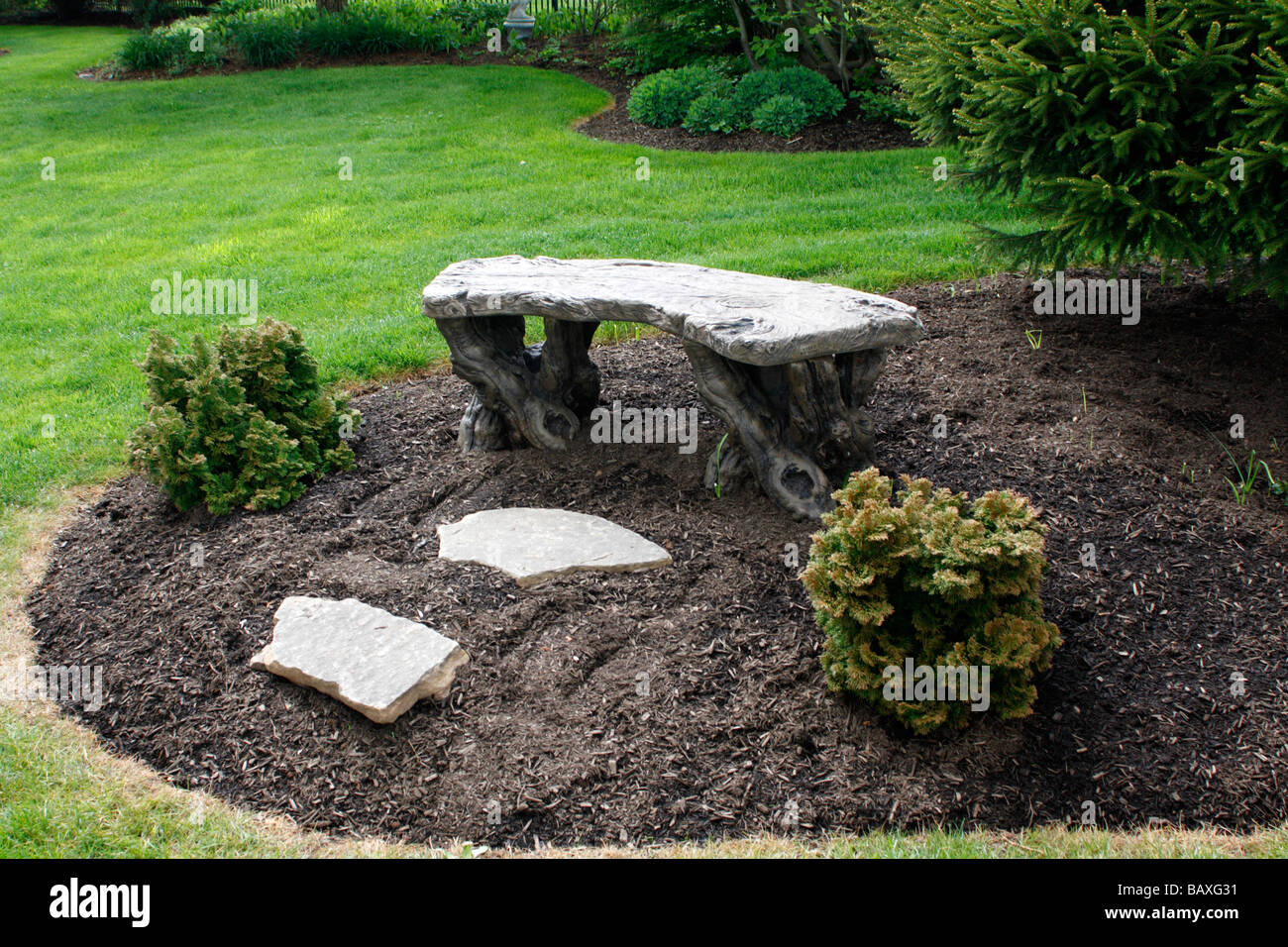 Unique bench with steps in park setting Stock Photo - Alamy