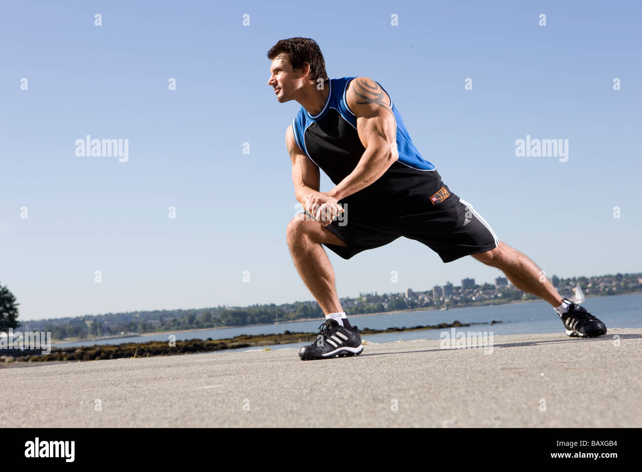 fit male stretching outdoors Stock Photo - Alamy