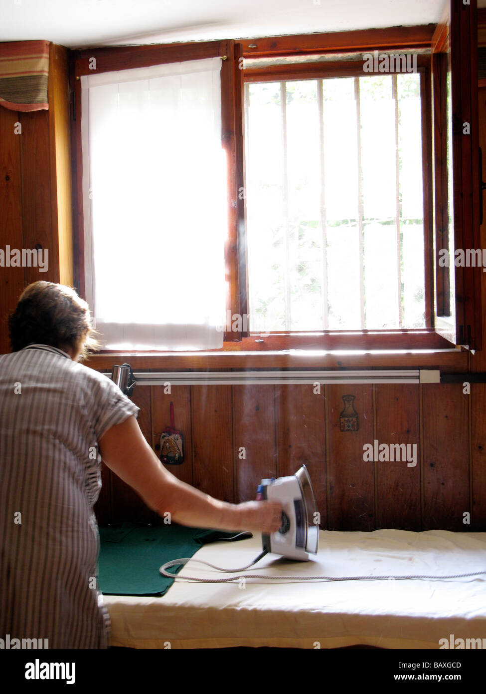 steam ironing in bright light Stock Photo - Alamy
