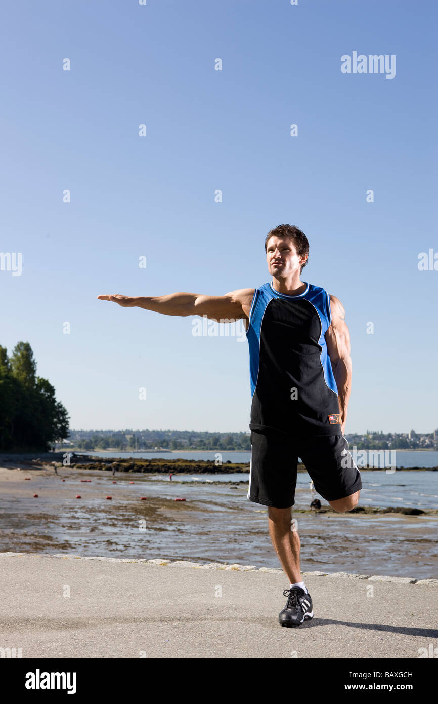 fit male stretching outdoors Stock Photo - Alamy